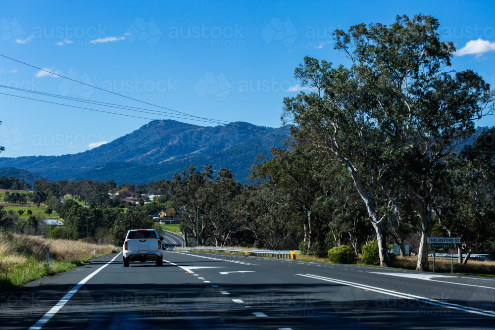 Image of Car travelling on country road in Australia in bright sunlight ...