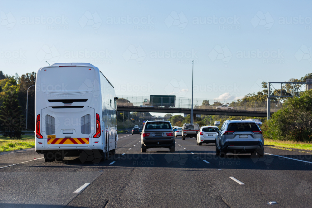 Image of Cars and bus on divided highway road with three lanes and ...