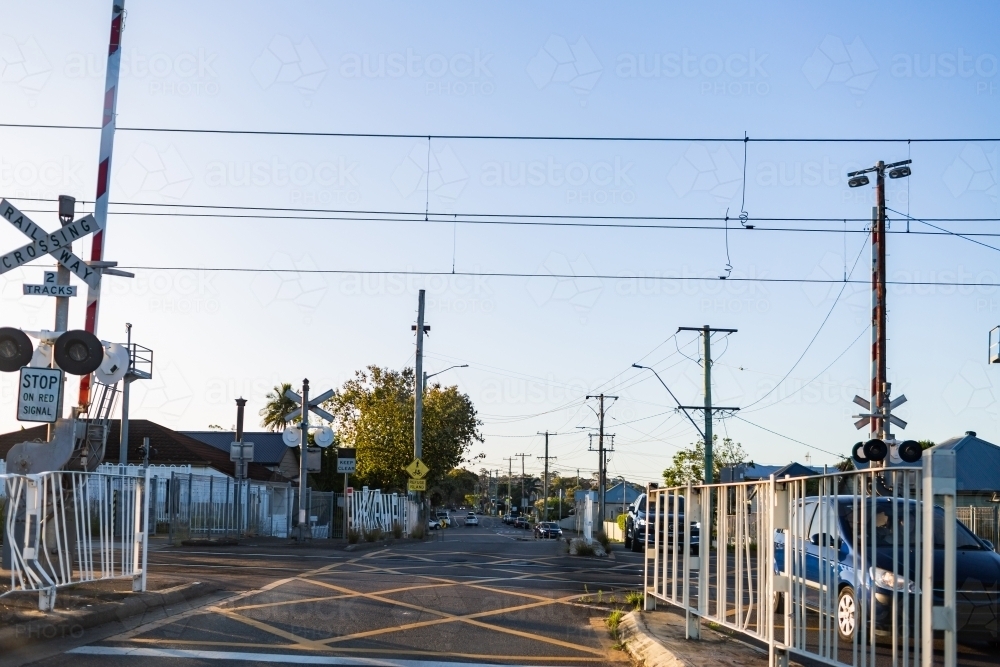 Image of Cars crossing over railway line on main road in Newcastle ...