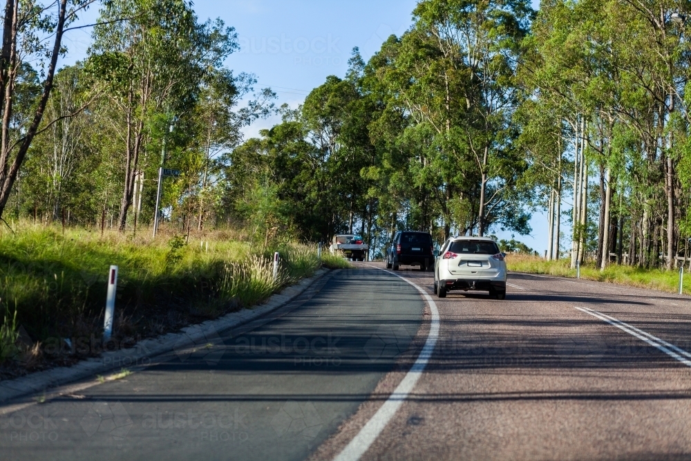 Image of Cars following one another along rural road in NSW Australia ...