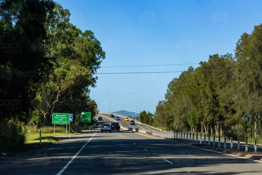 Image of Cars on highway crossing bridge - Austockphoto