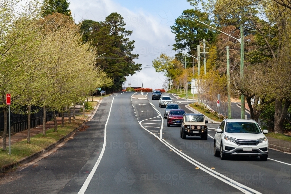 Image of Cars traveling down opposite side of road - Austockphoto
