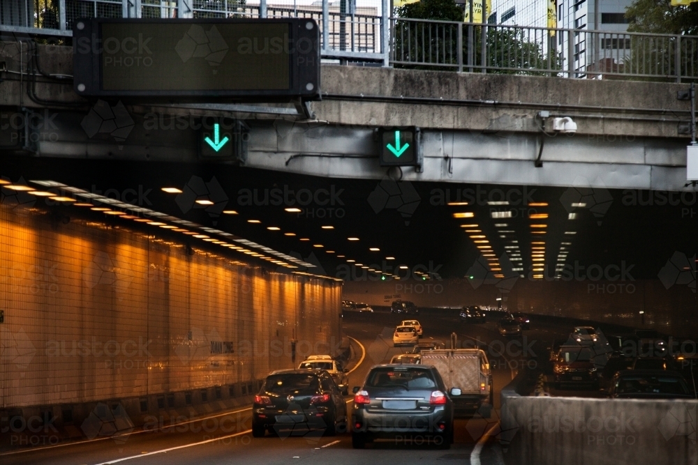 Image of Cars travelling through city toll road underground tunnel in ...