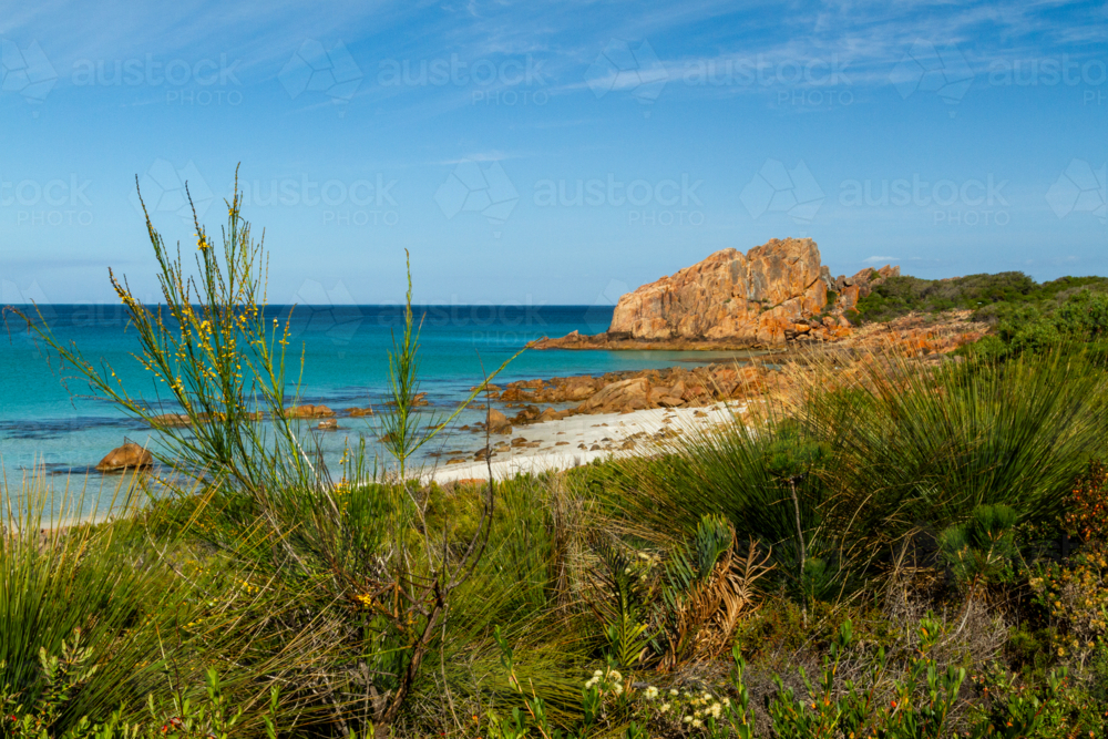 Image of Castle Rock, native bush, and the Indian Ocean. - Austockphoto