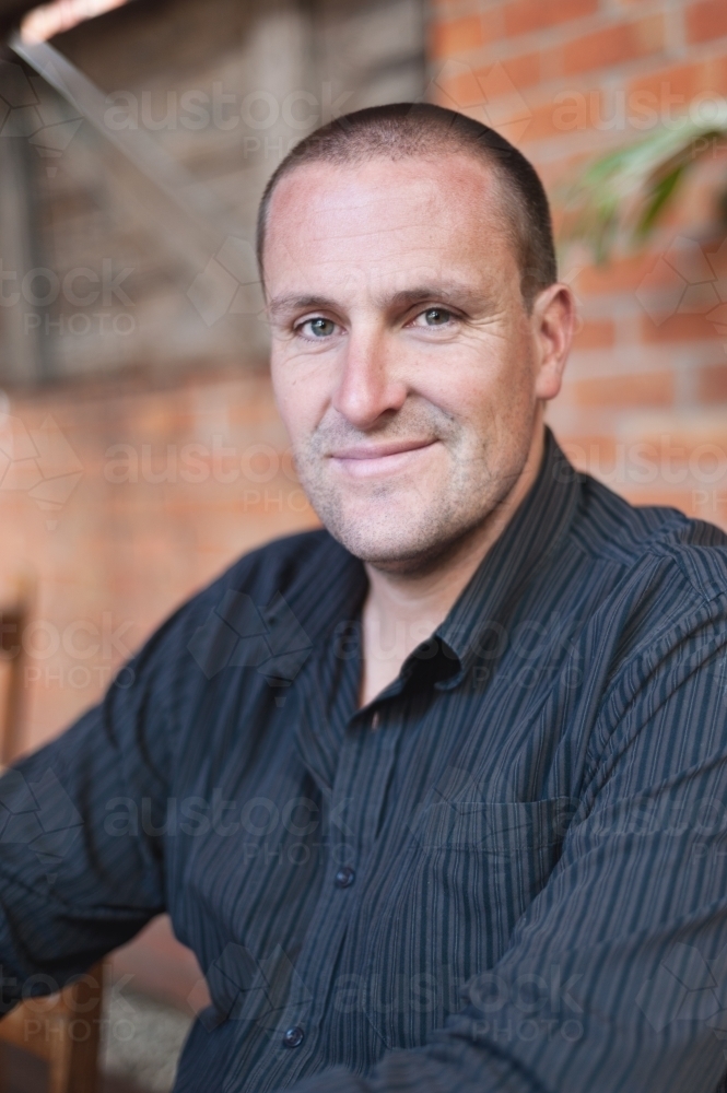 Image of Casual portrait of a 30-something man - Austockphoto
