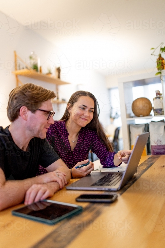 Image of Caucasian man and Aboriginal woman sitting together at a table ...