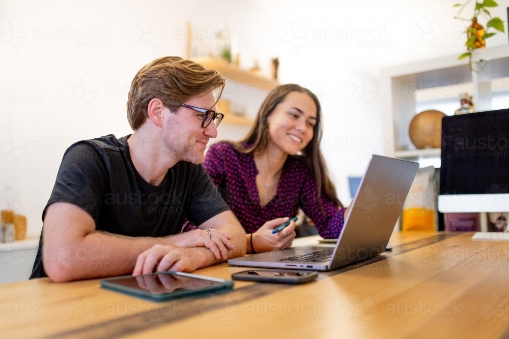Image of Caucasian man and Aboriginal woman sitting together at a table ...