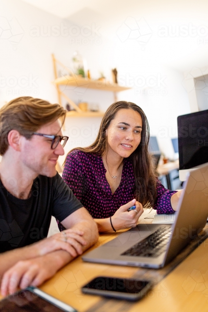 Image of Caucasian man and Aboriginal woman sitting together at a table ...