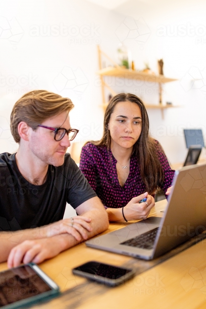 Image of Caucasian man and Aboriginal woman sitting together at a table ...