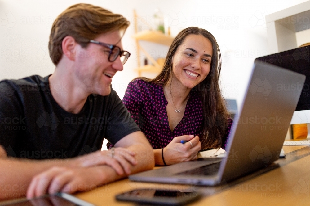 Image of Caucasian man and Aboriginal woman sitting together at a table ...