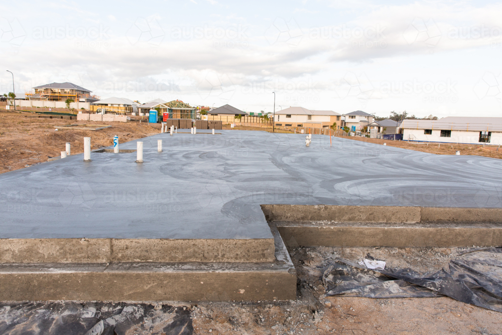 Image of cement house slab with plumbing in place for a new house build ...