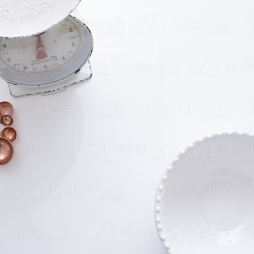 Image of Ceramic bowl, measuring spoons and scales on white background ...