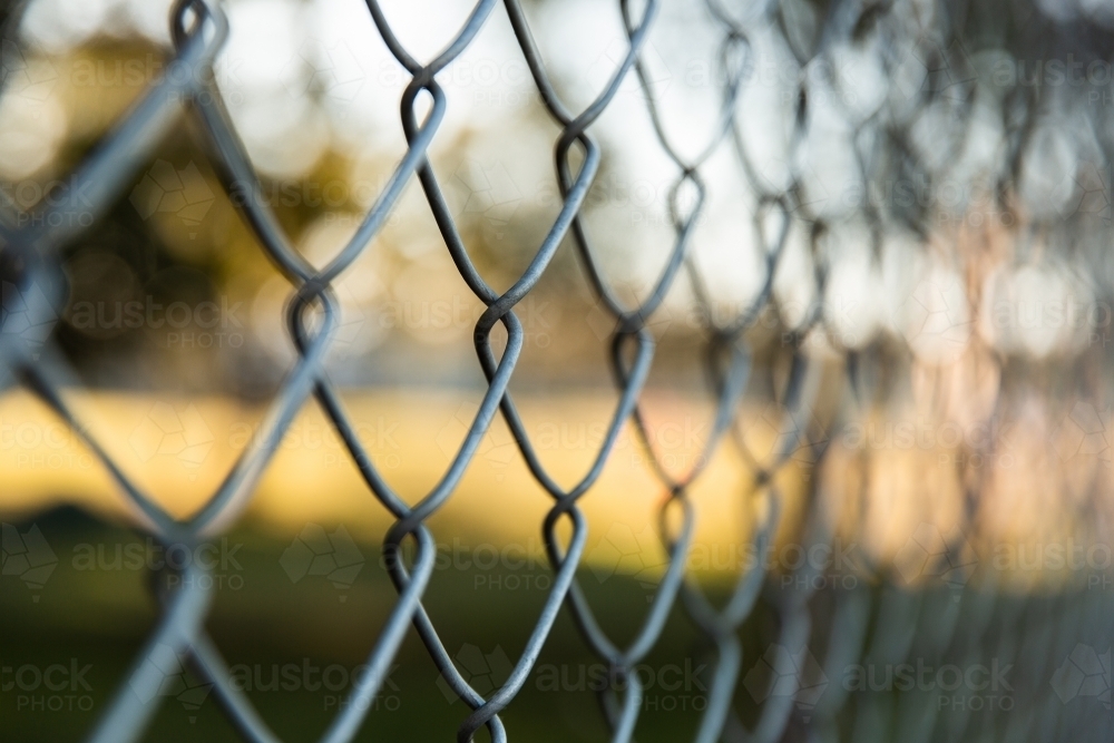 Image of chain link fence at a sporting club - Austockphoto