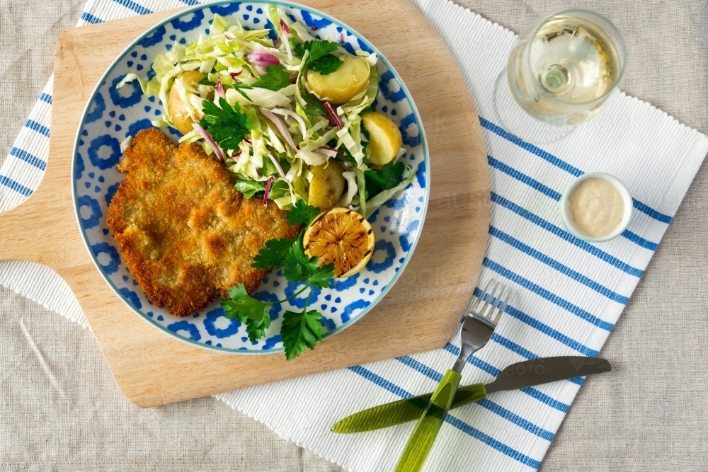 Image of Chicken schnitzel and salad dish - Austockphoto
