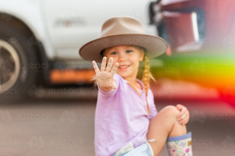Image of Child holding up hand covered in chalk - Austockphoto
