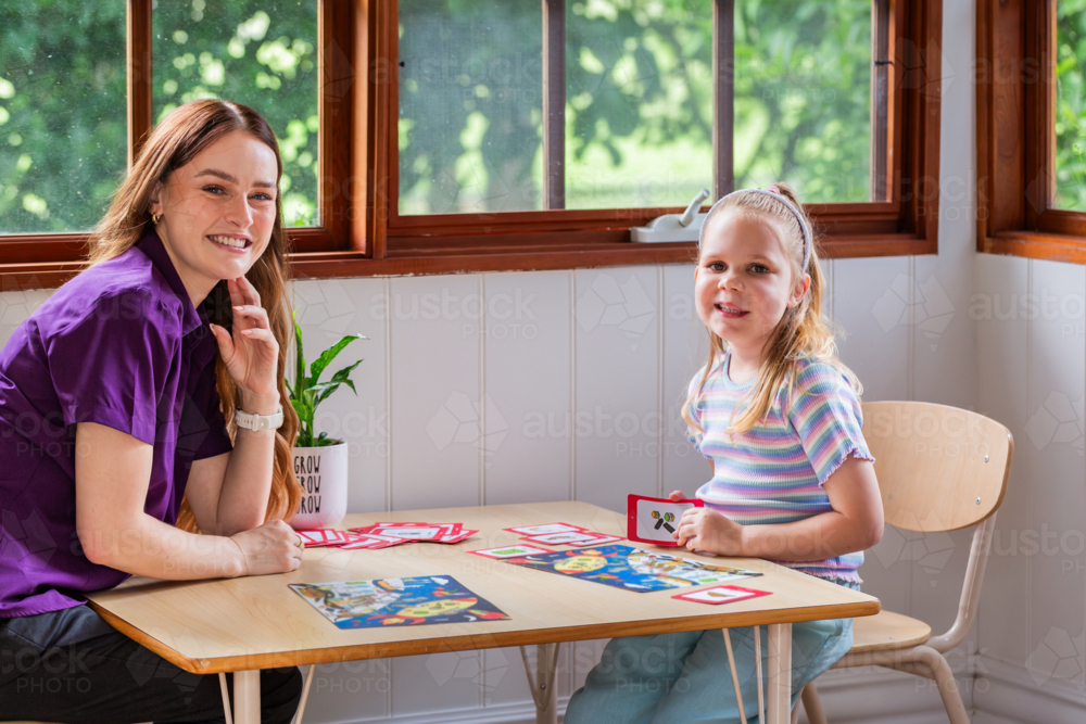 Image of Child with speech disability looking at sound cards talking ...