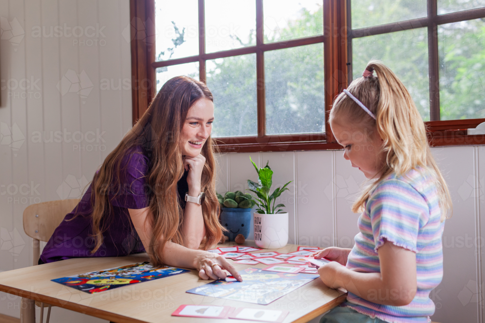 Image of Child with speech disability looking at sound cards talking ...