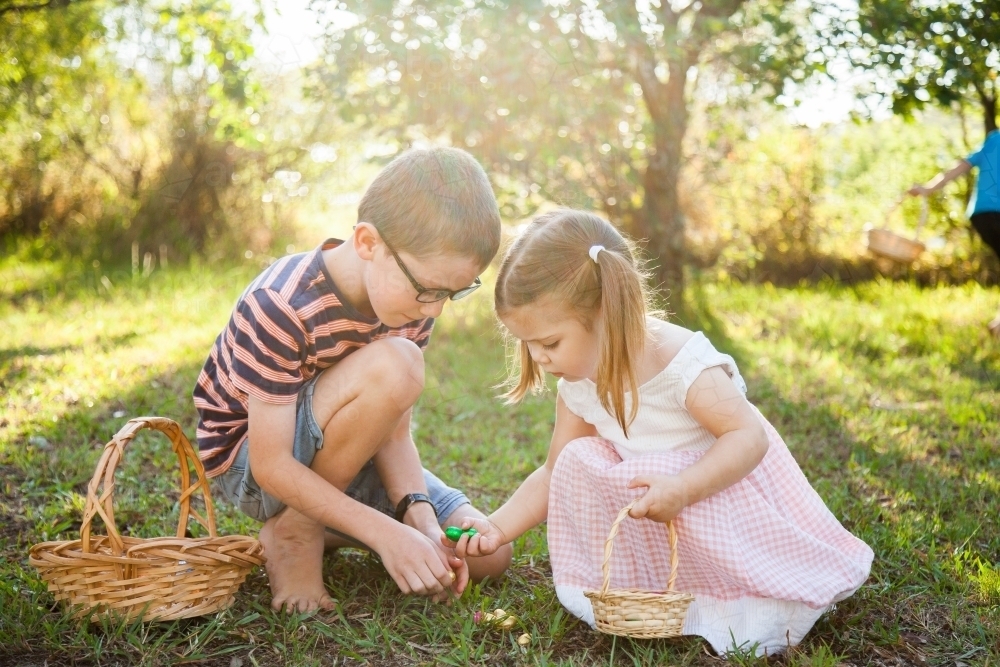 Image of Children finding colourful eggs on an Easter egg hunt ...
