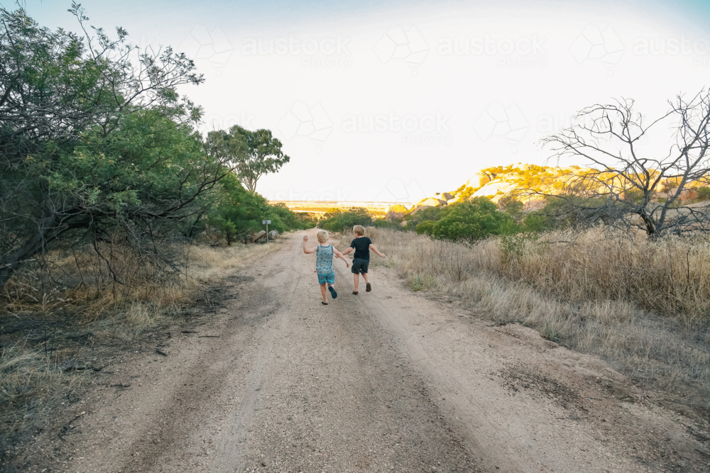 Image of Children walking along bush track on Summer adventure ...