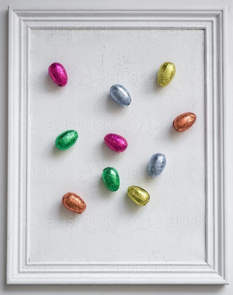 Image of Chocolate easter eggs in a frame - Austockphoto