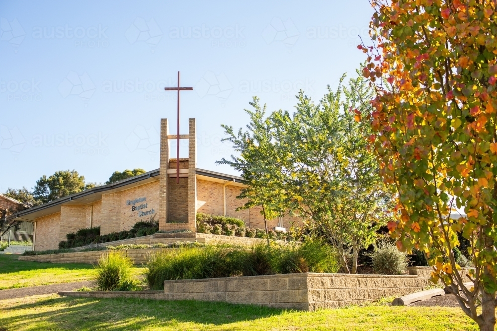Image of Christian church building with bright autumn colours on tree ...