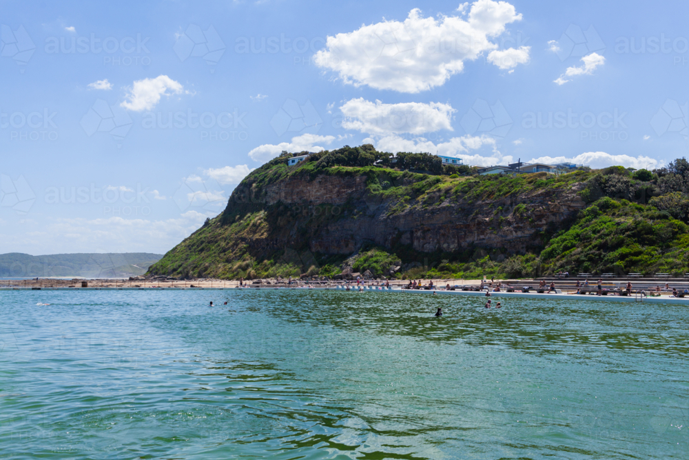 Image of cliff rising above Merewether Beach ocean pool on the ...