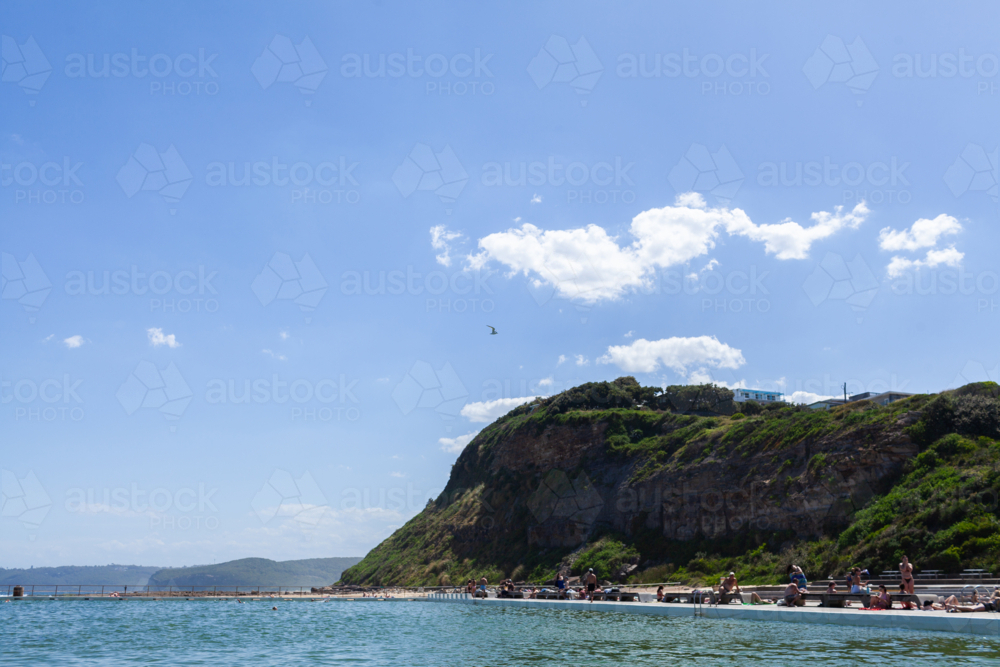 Image of cliff rising above Merewether Beach ocean pool on the ...