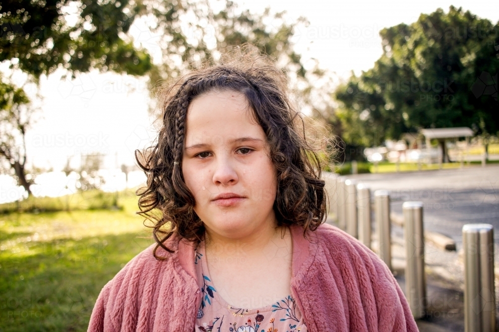 Image of Close-up of a girl crying and looking sad - Austockphoto