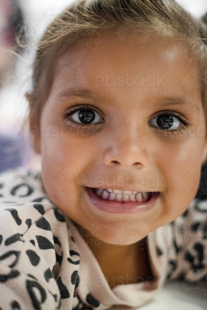 Image of Close-up of a young Aboriginal girl child’s face - Austockphoto
