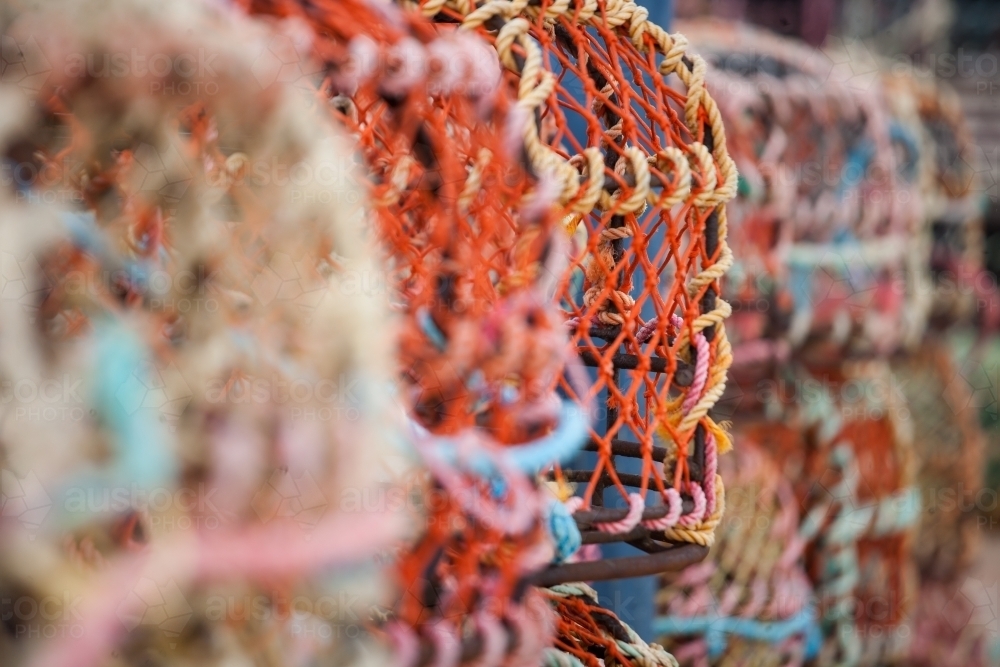 Image of close up of cray pots on a wharf in a coastal town - Austockphoto