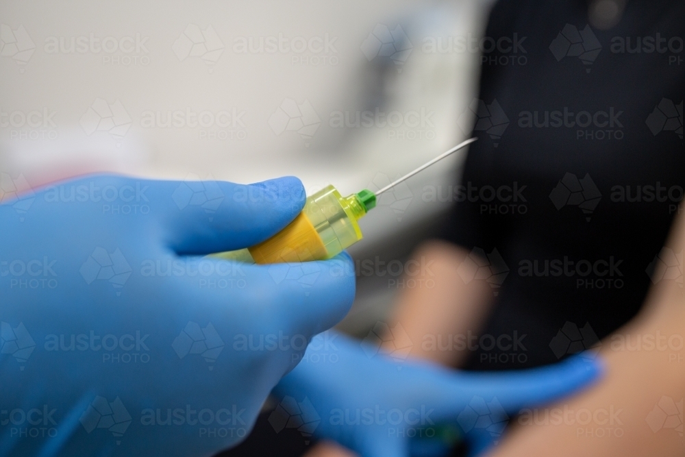 Image of Close-up of nurse's hands taking blood from a patient ...