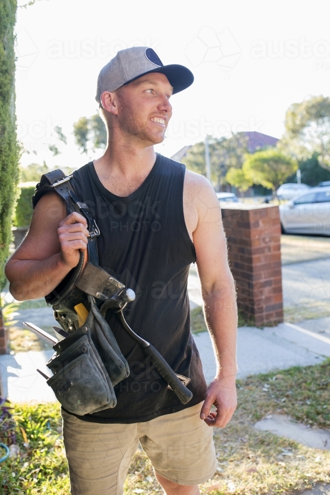 Image of Close up of tradesman with toolbelt - Austockphoto
