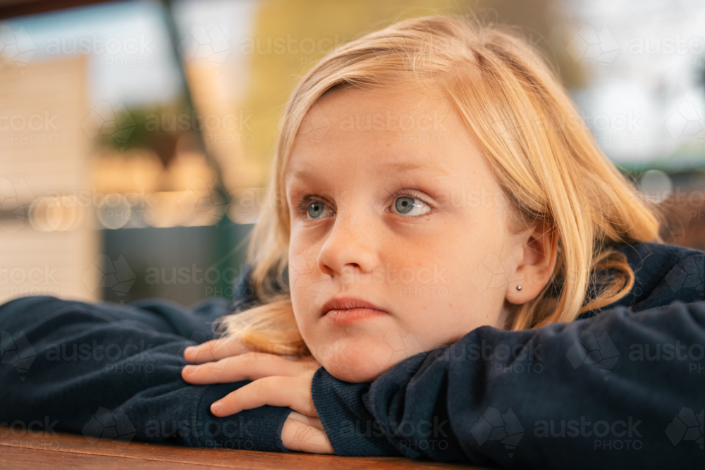 Image of Close up portrait of pre-teen boy with long blond hair and ...
