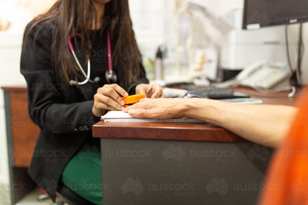 Image of close up shot of a female doctor checking a patient's pulse ...