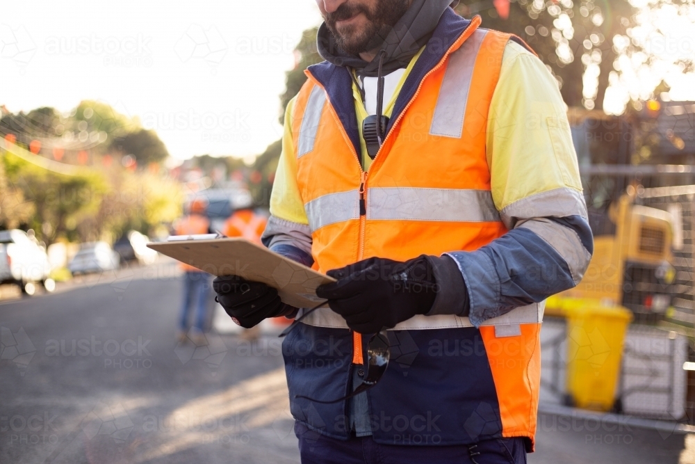 Image of Close up shot of a man road worker with beard wearing high-vis ...