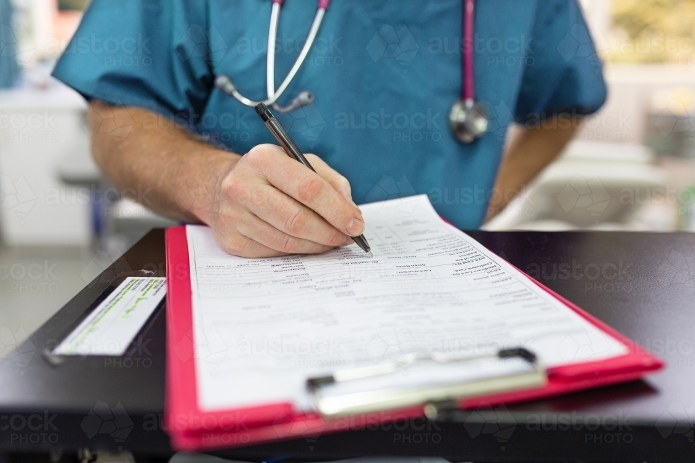 Image of Close up shot of a medical form filled up by a health care ...