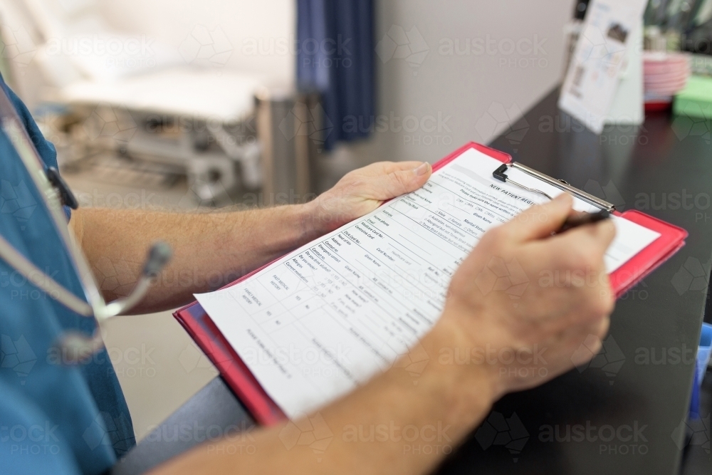 Image of Close up shot of a medical form filled up by a health care ...