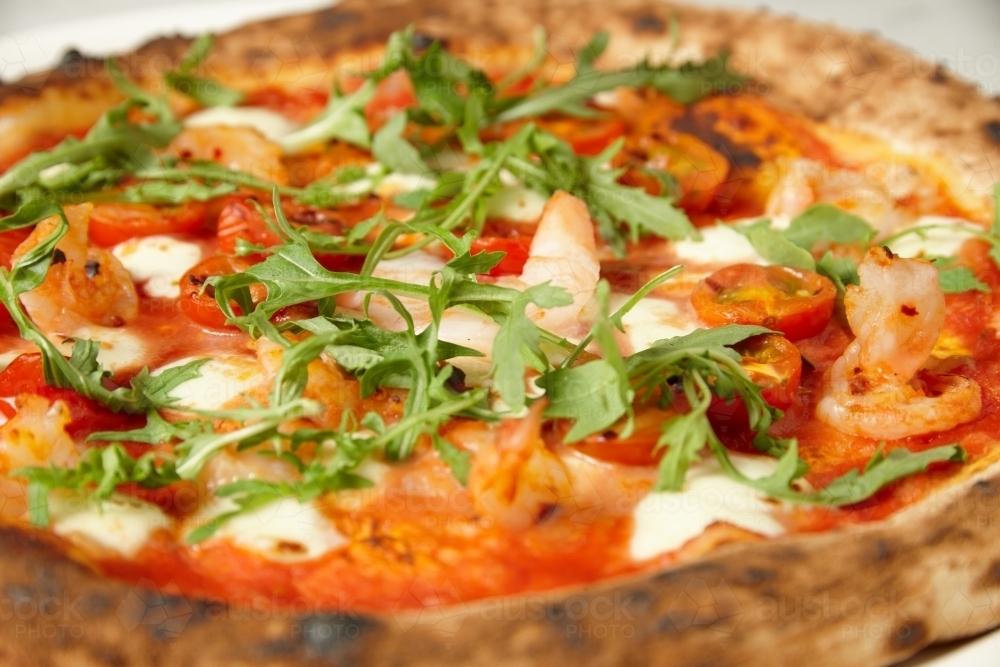 Image of close up shot of california style pizza - Austockphoto