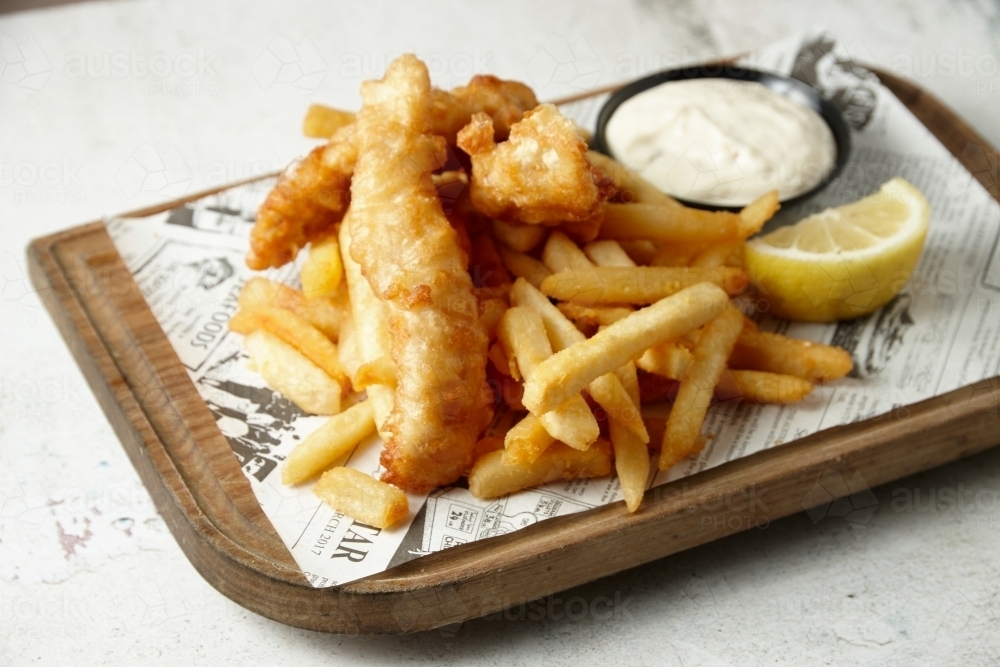 Image of Close up shot of fish and chips - Austockphoto