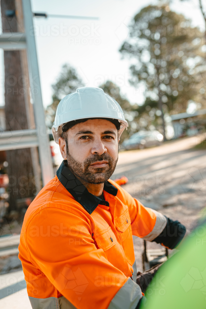 Image of Closeup of a construction worker sitting on the ground of the ...
