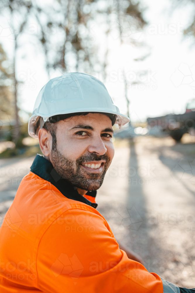 Image of Closeup of a construction worker sitting on the ground of the ...
