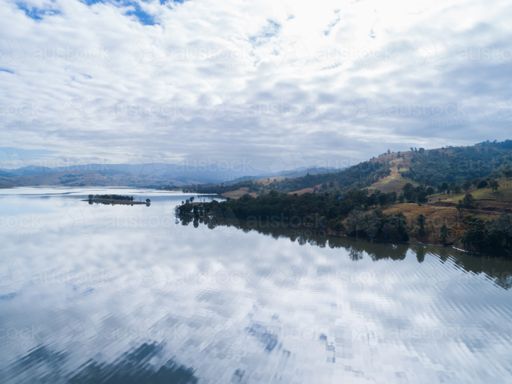 Image of Clouds and sky reflecting in waters of lake in the Hunter ...