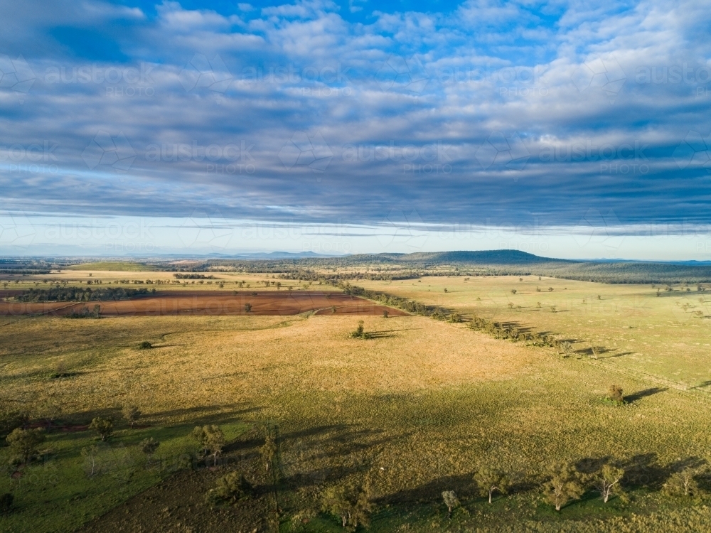 Image of Clouds casting shadows over rural farm land with pastoral ...