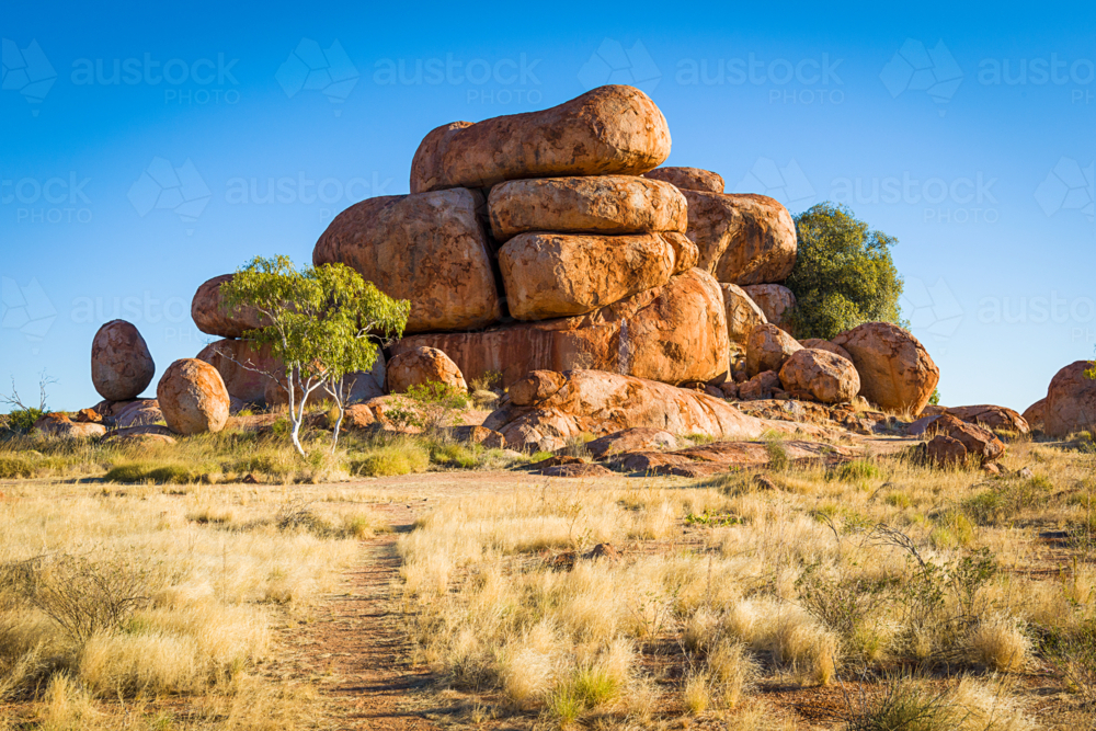 Image of Cluster of granite boulders at the Devils Marbles - Austockphoto