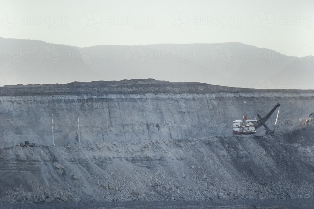 Image of Coal Mining machinery digging in an open cut mine - Austockphoto