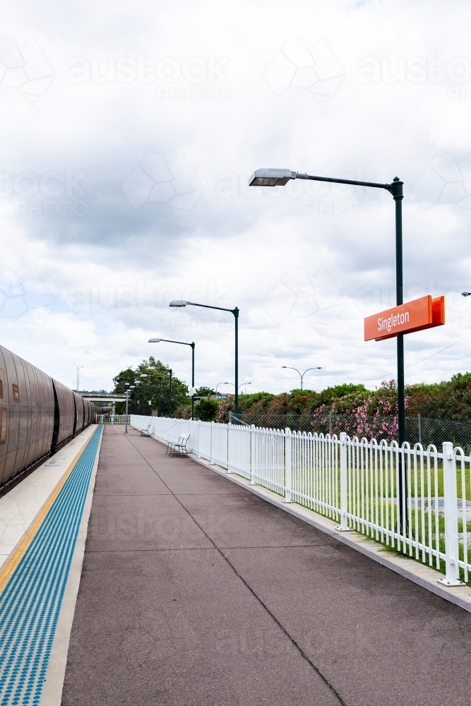 Image of Coal train passing singleton train station railway platform on ...
