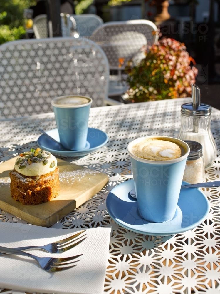 Image of Coffees and cake at a cafe - Austockphoto