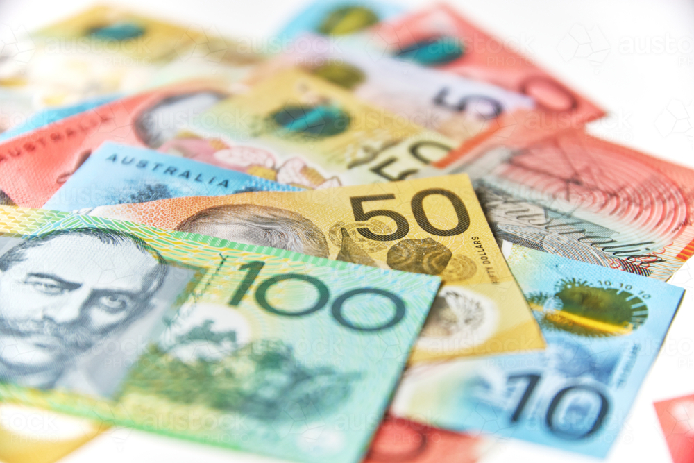 Image of Collection of Australian banknotes scattered on a flat surface ...