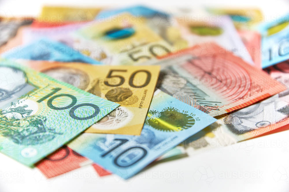 Image of Collection of Australian banknotes scattered on a flat surface ...