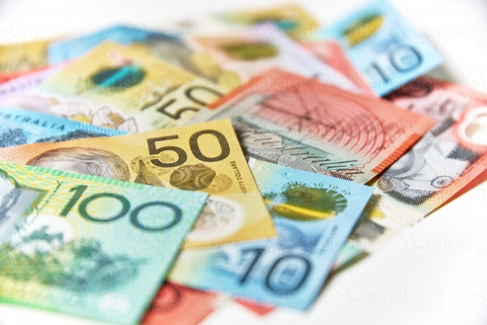 Image of Collection of Australian banknotes scattered on a flat surface ...